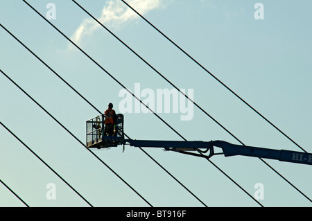 High reach access platform (cherry picker) working on a cable stayed ...