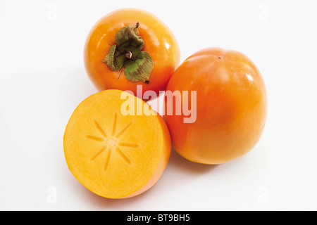 Persimmon or Sharon Fruit cut open showing flesh Stock Photo - Alamy