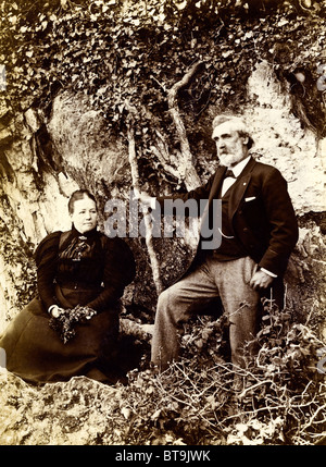 Elderly Victorian couple husband and wife pose in a photographers ...