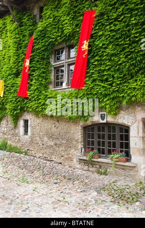 Cobblestone street, medieval walled town of Perouges labelled les Plus ...