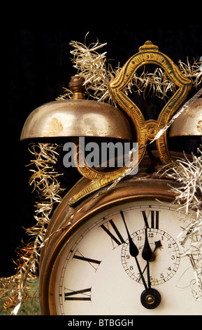 Vintage alarm clock on christmas background Stock Photo - Alamy