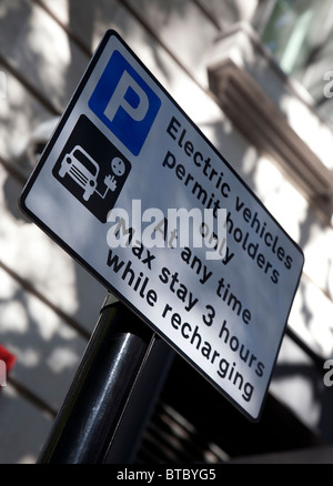 Green Sign Electric Vehicle Parking Only at Concrete Wall Stock Photo ...