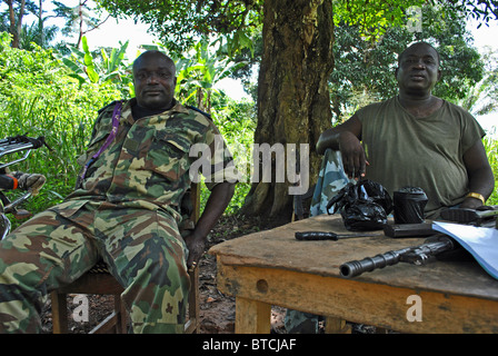 Soldiers in the Ivory Coast army at a roadblock near the border with ...