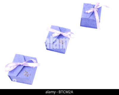 Three small lilac gift-boxes isolated on white background Stock Photo ...