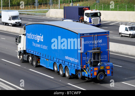 Fork lift truck on back view of Topps Tiles trailer transport behind ...
