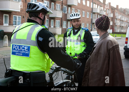 Police Community Support Officers chat with a local resident on a ...