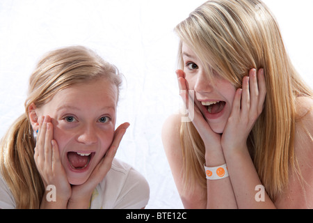 Excited teenager girl 12, 13, 14 years old with smart phone. Hipster ...