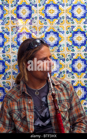 Man in sunglasses smoking a hookah Stock Photo - Alamy