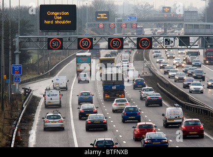 Signage on the M42 motorway in the West Midlands advising motorists to ...