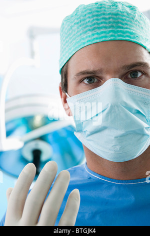 Close up picture of medical surgeon holding digital thermometer and ...