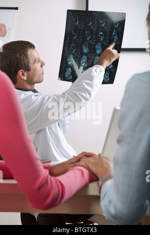 Mri, doctor and woman holding hands of patient in hospital before ...
