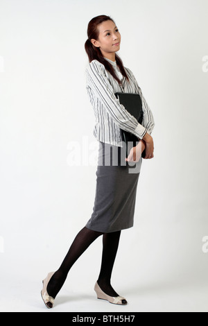 Office lady takes notebook computer Stock Photo - Alamy