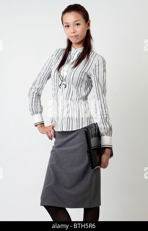 Office lady takes notebook computer Stock Photo - Alamy