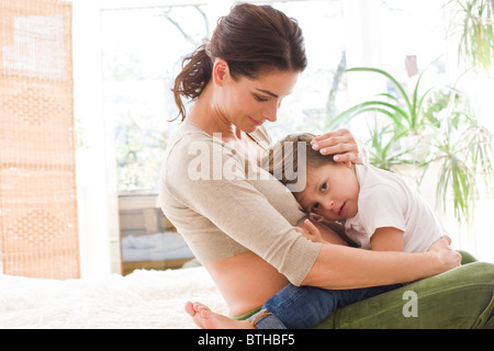 Mother hugging sad son Stock Photo - Alamy