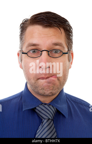 Funny crazy looking nerd in thick lens glasses sitting in office and ...