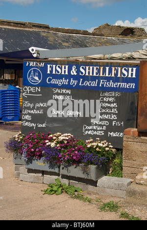 Fresh fish sold here sign Stock Photo - Alamy