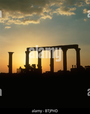 Palmyra, Syria, sunrise over ruins, 16th century Arab castle beyond ...