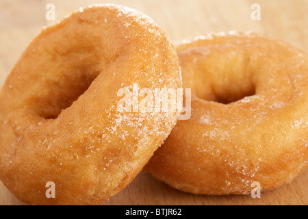 simple plain lightly sugar coated donuts known as gravy rings with bite ...