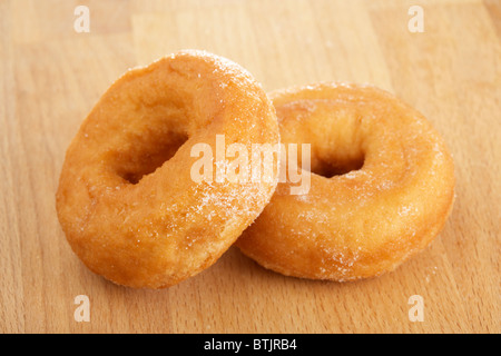 simple plain lightly sugar coated donuts known as gravy rings with bite ...