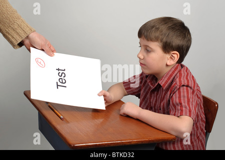 A boy receiving a failing test score Stock Photo - Alamy