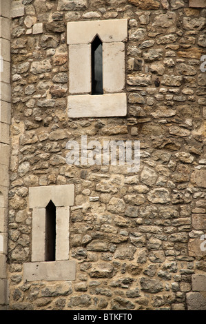 arrow slit windows in a wall of The Tower of London Stock Photo - Alamy
