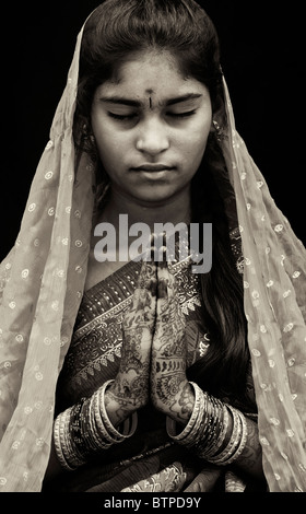 Portrait of an Indian woman wearing a sari and henna tattoos on her ...