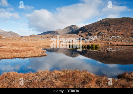 Small tarn with mountain reflection, Isle of Harris, Outer Hebrides ...