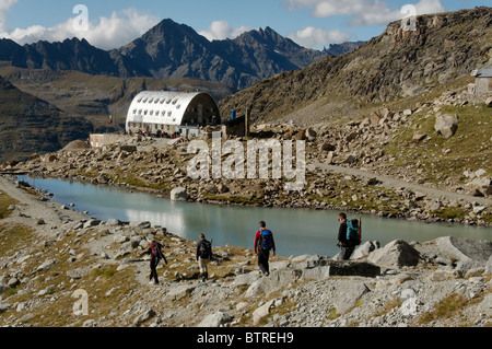 Walkers approaching the Vittorio Emanuele hut in the Gran Paradiso ...