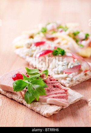 Three slices of crispbread with various toppings Stock Photo - Alamy