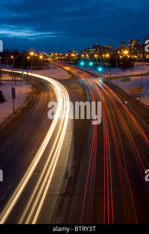 Light streaks from cars driving by an night Stock Photo - Alamy
