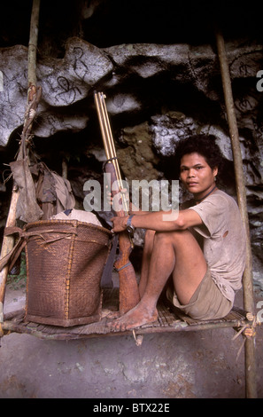 A Tau't Batu man with an airgun and his entire belongings on the ...