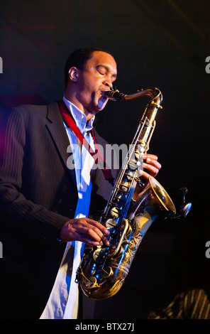 Male saxophonist plays the saxophone in park Stock Photo - Alamy