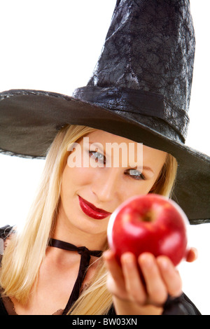 Witch hand holding red apple as symbol of temptation, poison. Pastel ...