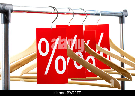 Image of several wooden hangers with red labels showing discount on ...
