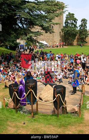 People enjoying a small play put on by the thespians at Warwick Castle ...
