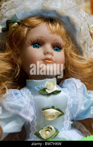Portrait of a blonde girl with blue eyes without makeup on a light ...