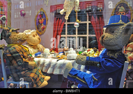 The window of Hamleys Toy Store displays a picture of the Queen in ...