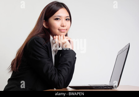 Office lady uses notebook computer Stock Photo - Alamy