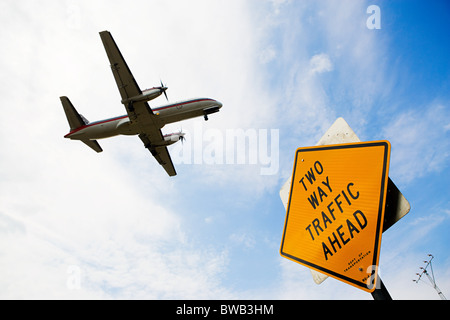 Airplane and traffic sign Stock Photo - Alamy