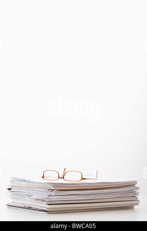 A vertical shot of a stack of documents on a paper stand Stock Photo ...