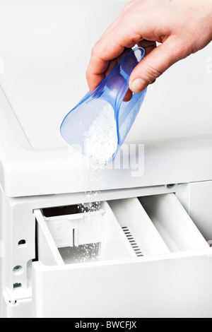 Filling detergent in the washing machine dispenser compartment Stock ...