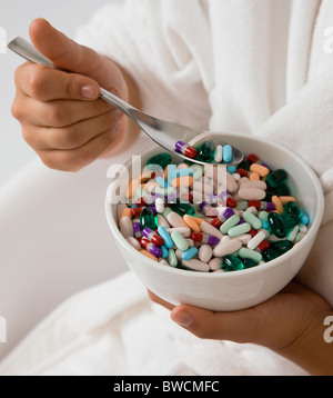 Young hispanic woman holding pills with open hand doing stop sign with ...