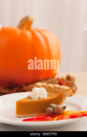 Pumpkin Pie Slice with Autumn Drink and Festive Table Decor Stock Photo ...