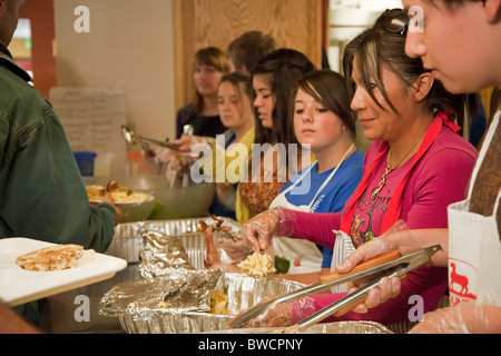Volunteers Serve Meal at Homeless Shelter Stock Photo - Alamy