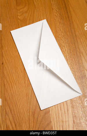 Letter envelope on wood table Stock Photo - Alamy