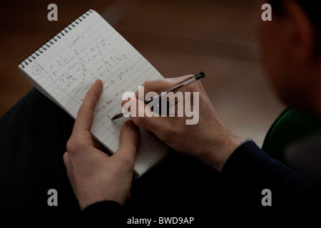 A reporter pictured writing in shorthand during an interview in London ...