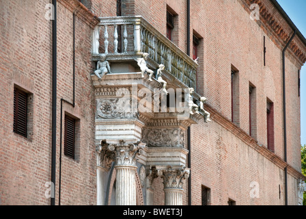 Balcony with sculptured details of children on the facade of Palazzo ...