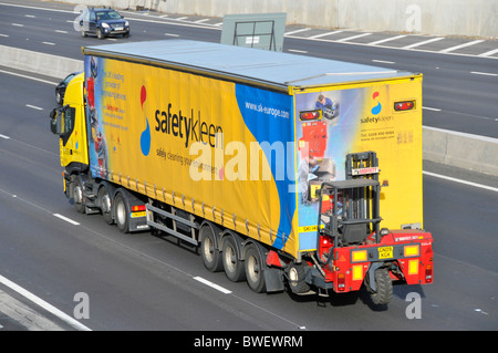 Fork lift truck on back view of Topps Tiles trailer transport behind ...