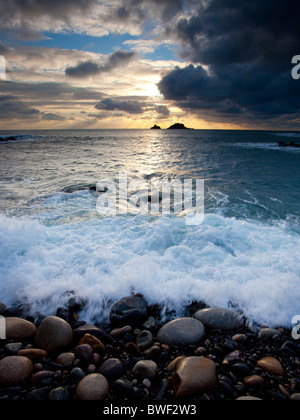 Sunset over Cape Cornwall from the rocky shores of Porth Ledden ...