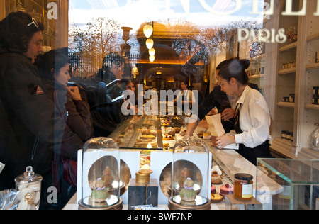 Reflection on a traditional French patisserie window alogside Les ...